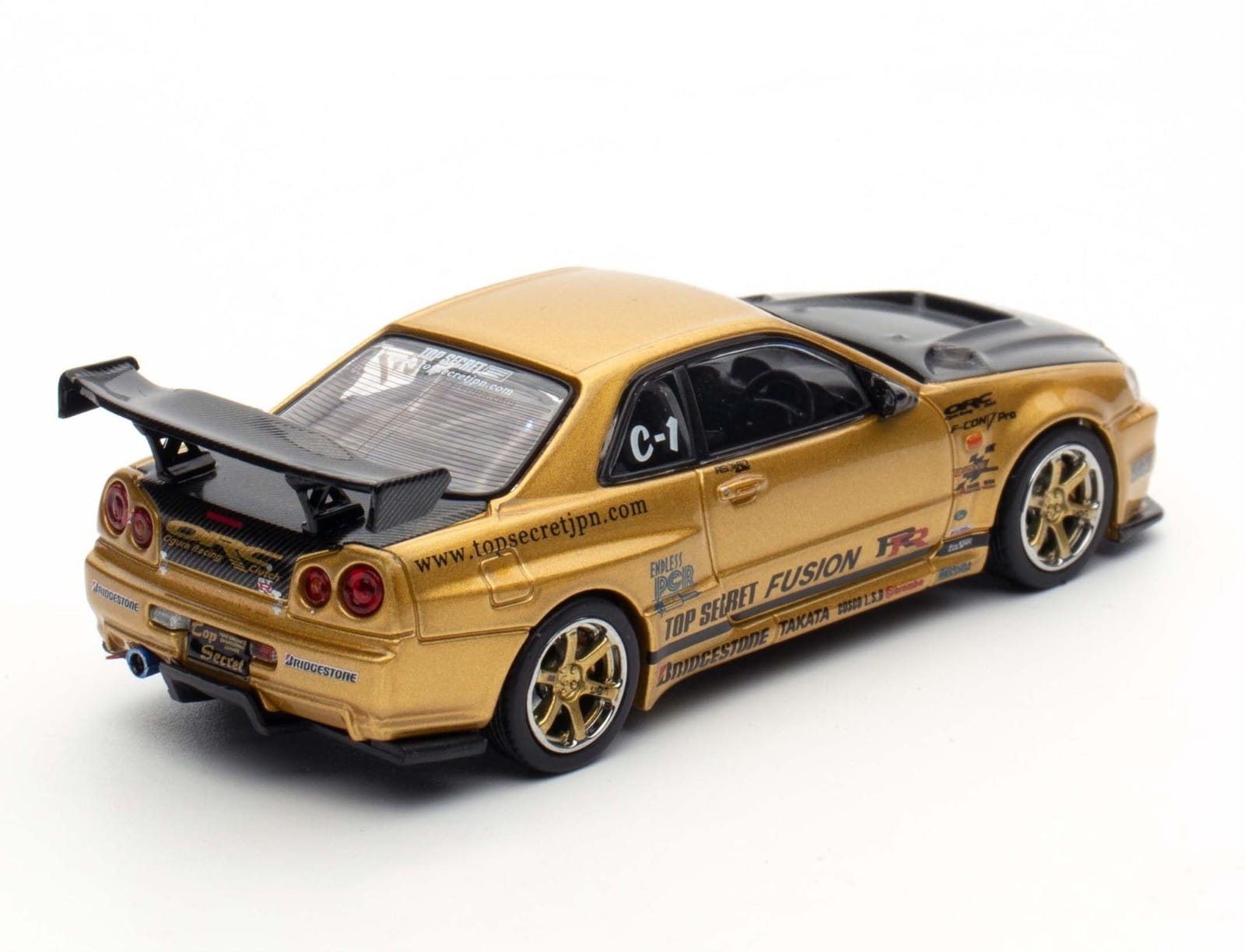 Nissan R34 GT-R Top Secret Gold Inno64 1:64 ModelCarShop